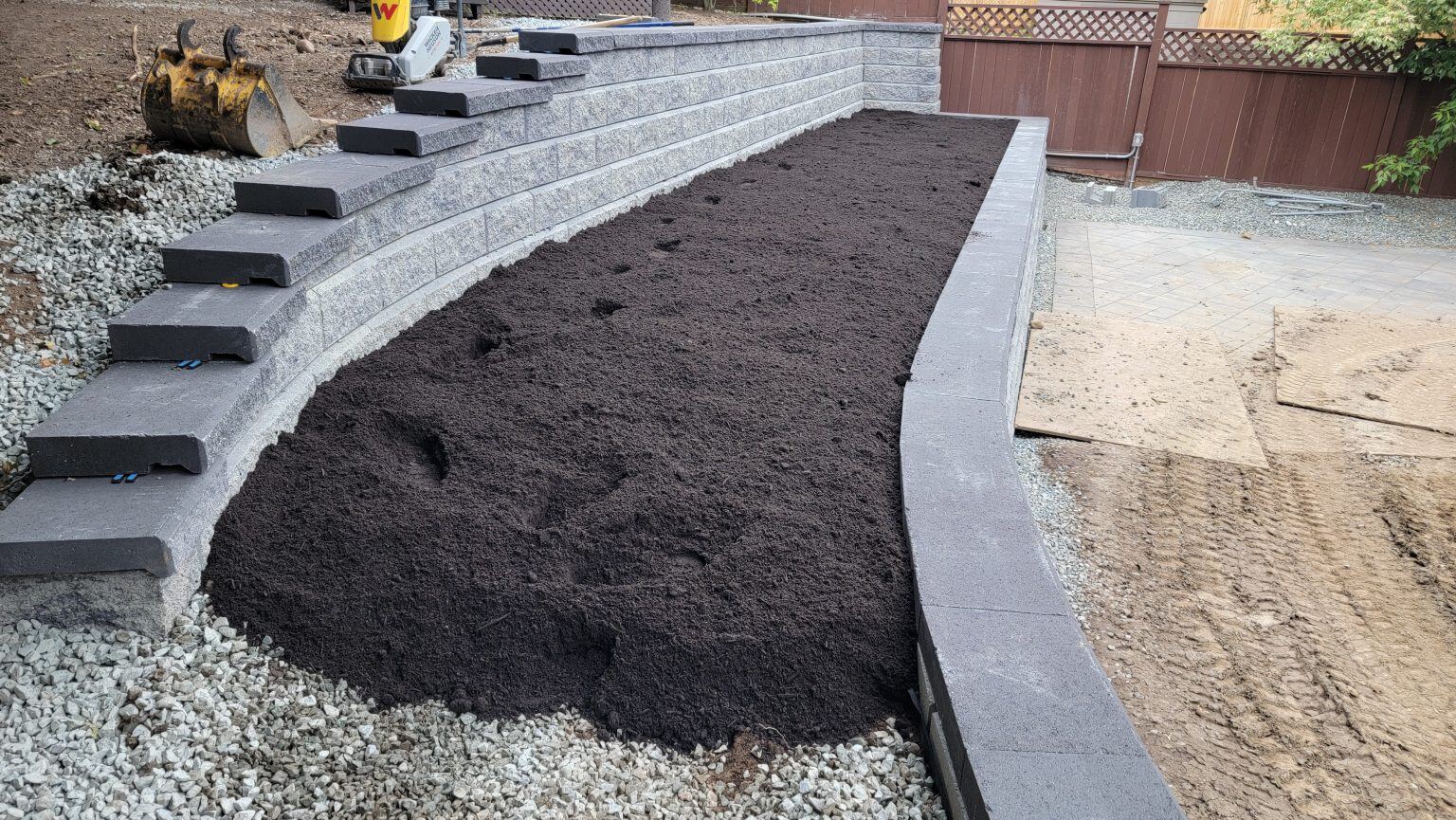 Gluing Allan Block Retaining Wall Caps and Blocks